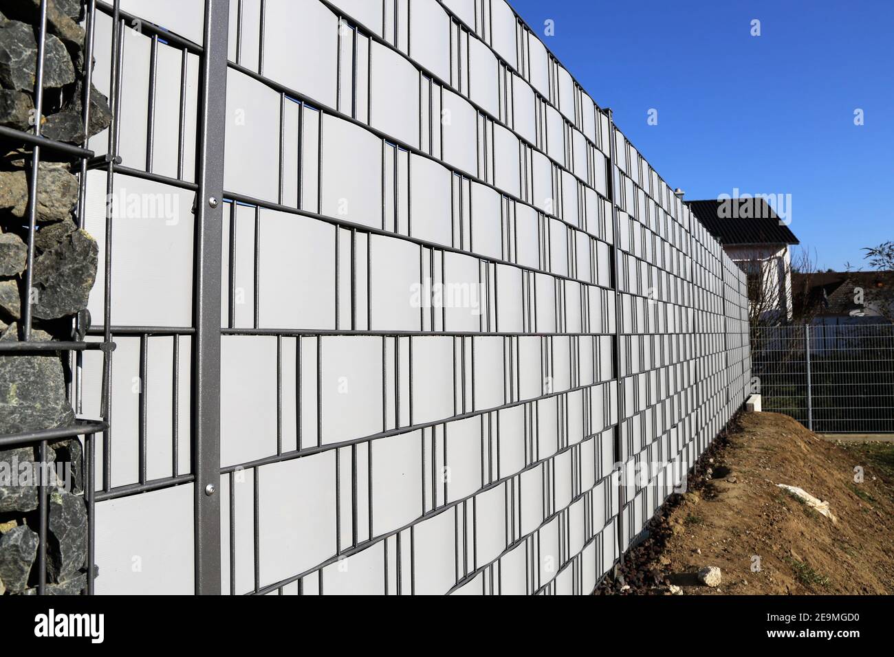 Modern new privacy fence as a boundary of the property Stock Photo - Alamy