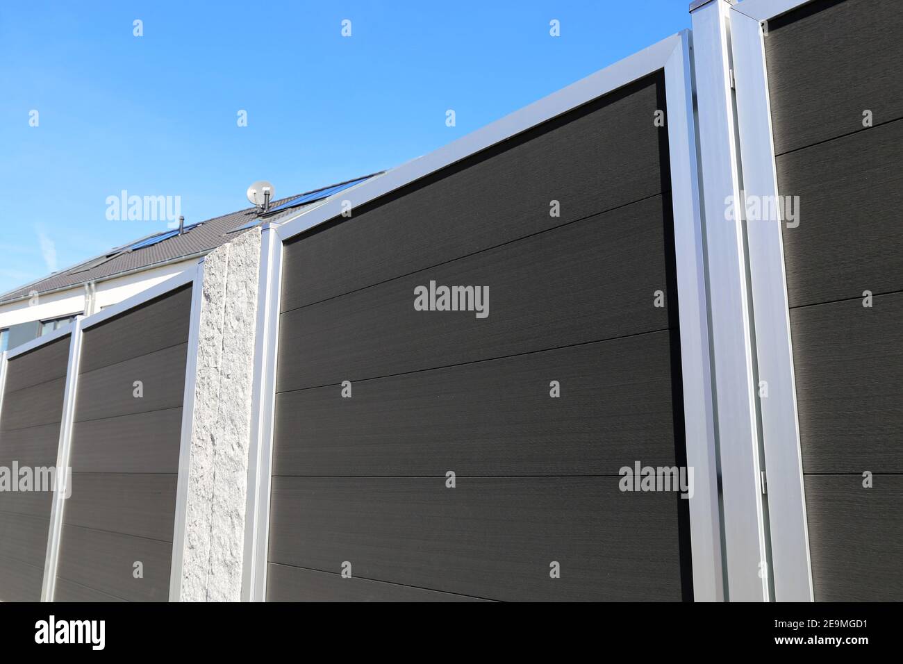 Modern new privacy fence as a boundary of the property Stock Photo - Alamy