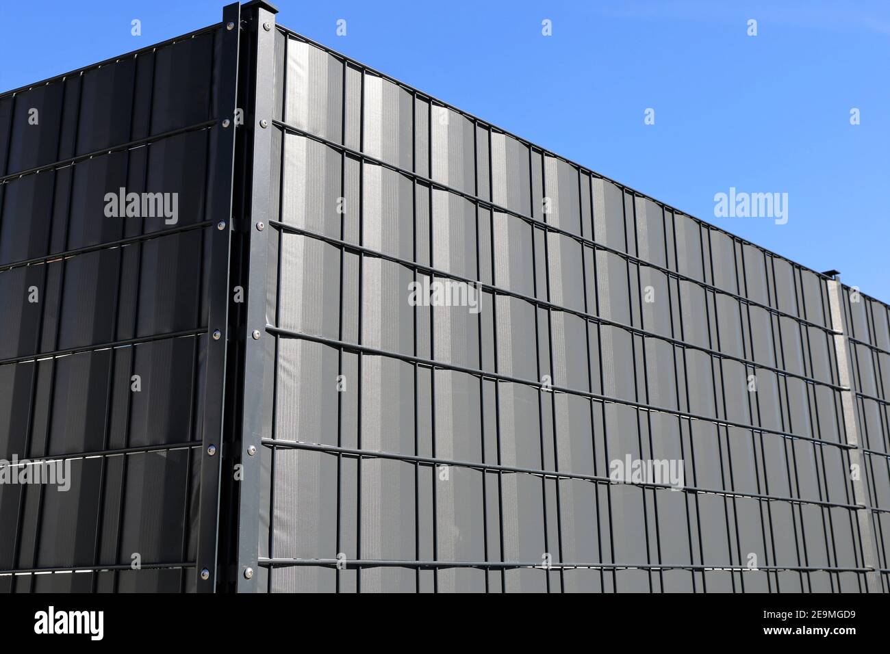 Modern new privacy fence as a boundary of the property Stock Photo - Alamy