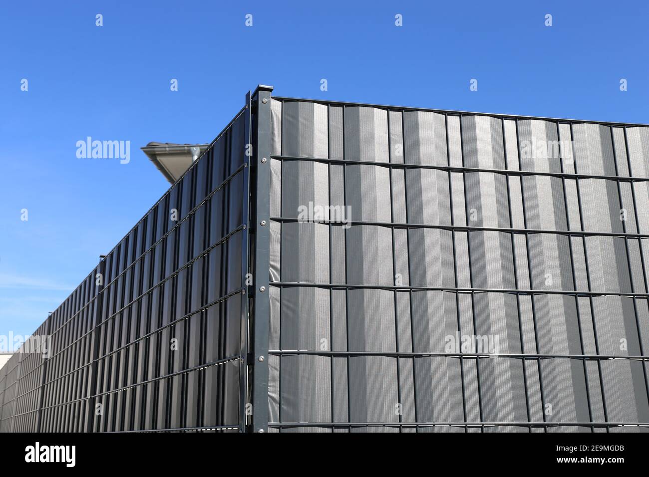 Modern new privacy fence as a boundary of the property Stock Photo - Alamy
