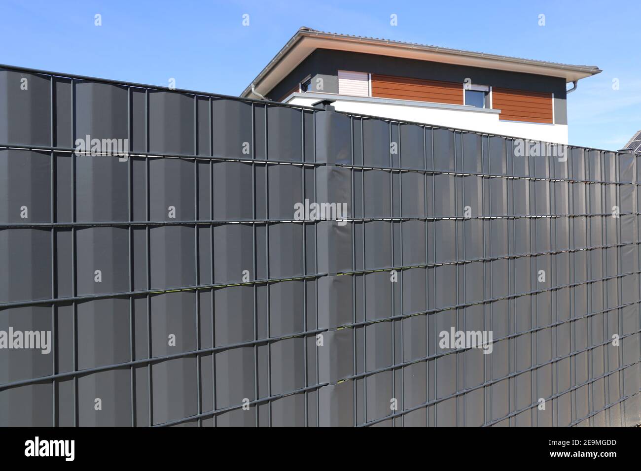 Modern new privacy fence as a boundary of the property Stock Photo - Alamy