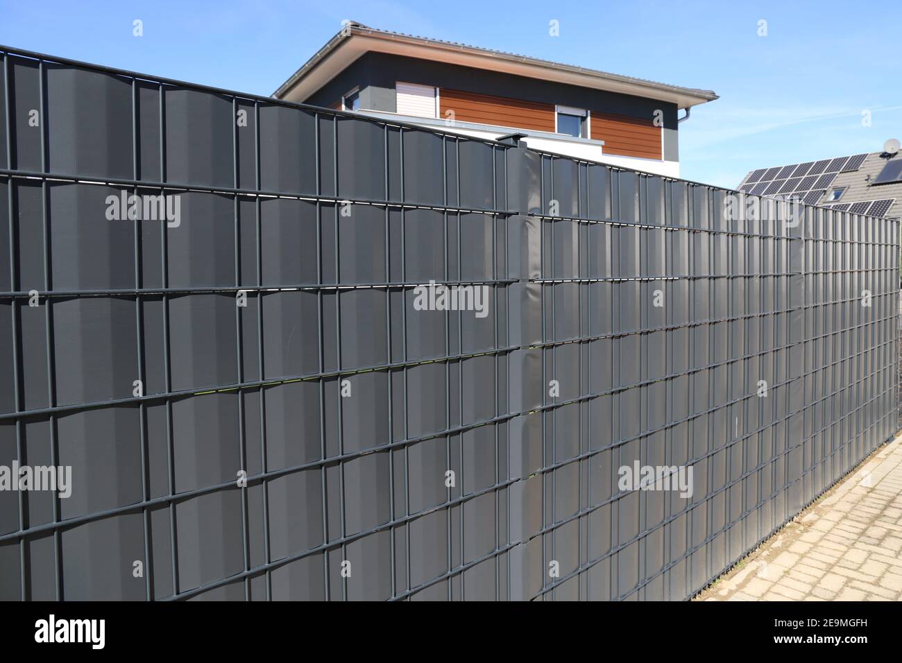 Modern new privacy fence as a boundary of the property Stock Photo - Alamy
