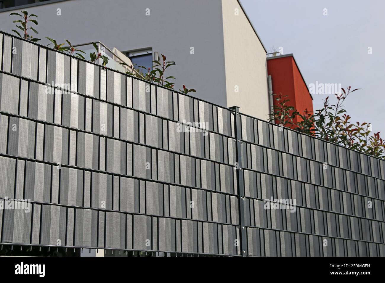 Modern new privacy fence as a boundary of the property Stock Photo - Alamy