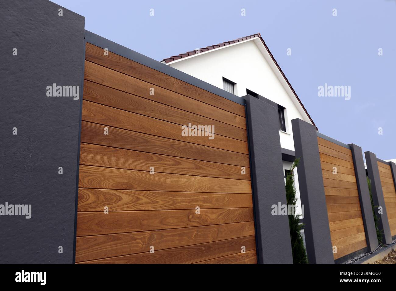 Modern new privacy fence as a boundary of the property Stock Photo - Alamy