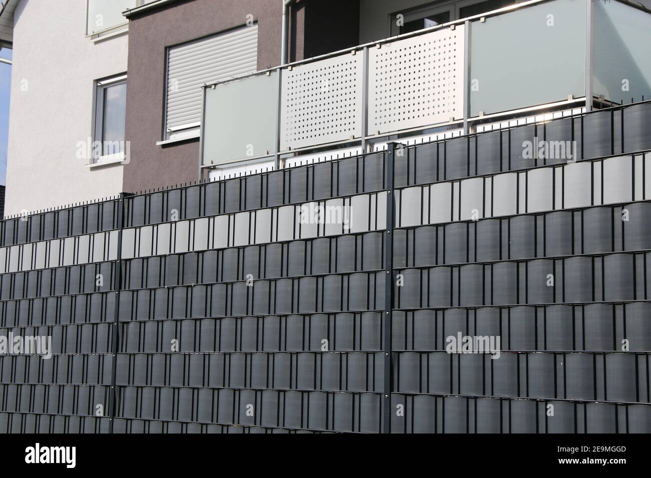 Modern new privacy fence as a boundary of the property Stock Photo - Alamy