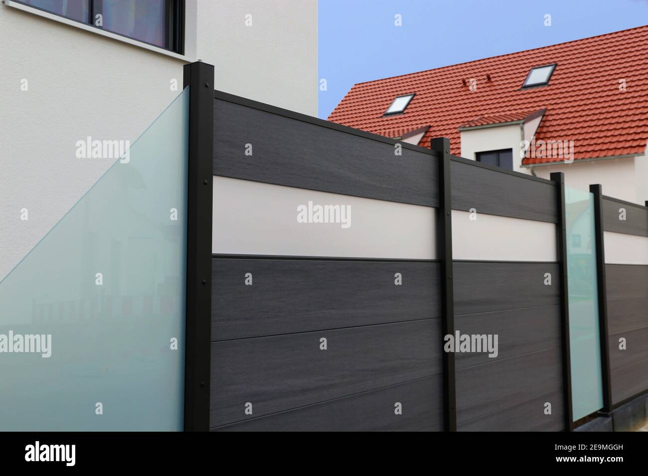 Modern new privacy fence as a boundary of the property Stock Photo - Alamy