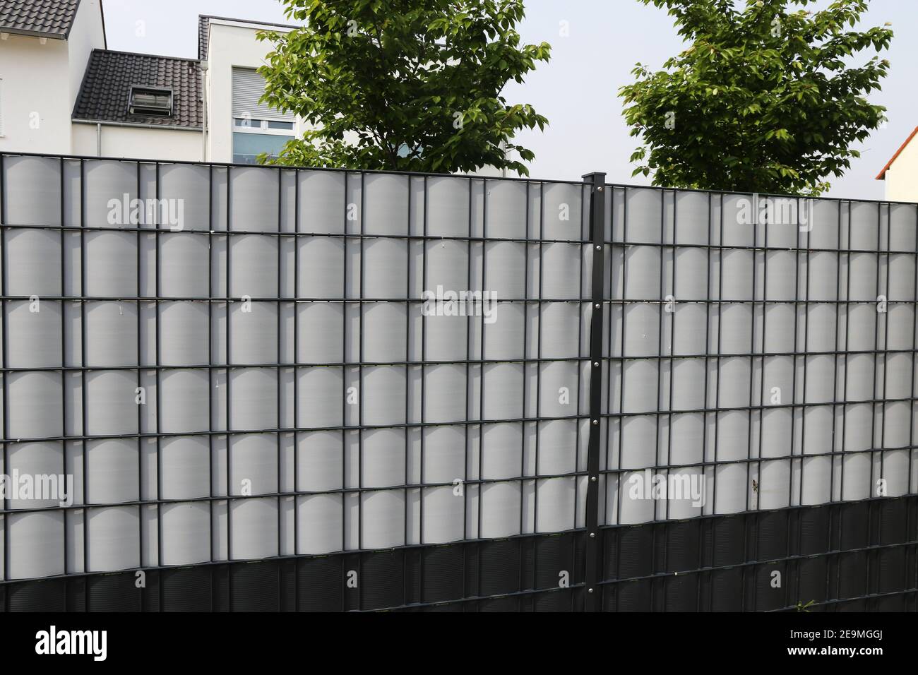 Modern new privacy fence as a boundary of the property Stock Photo - Alamy