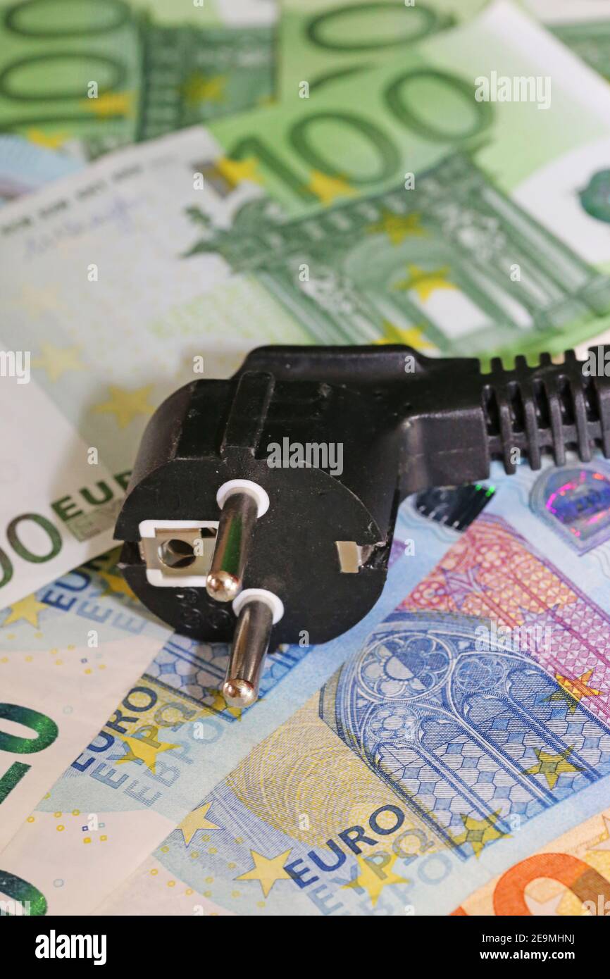 Symbol image electricity costs with european banknotes Stock Photo - Alamy