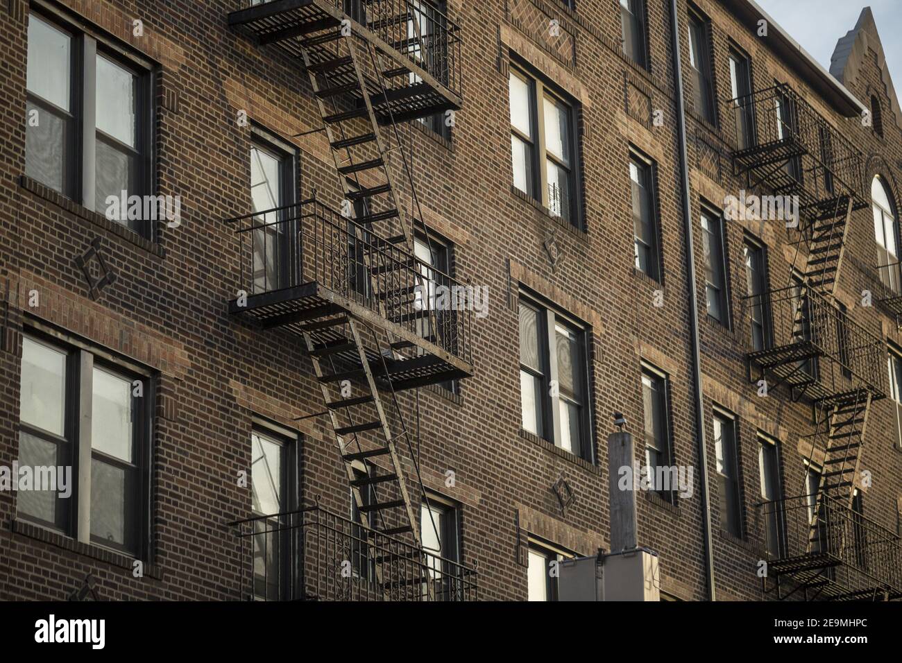 Old brick building with an exterior stair fire escape, New York, USA ...
