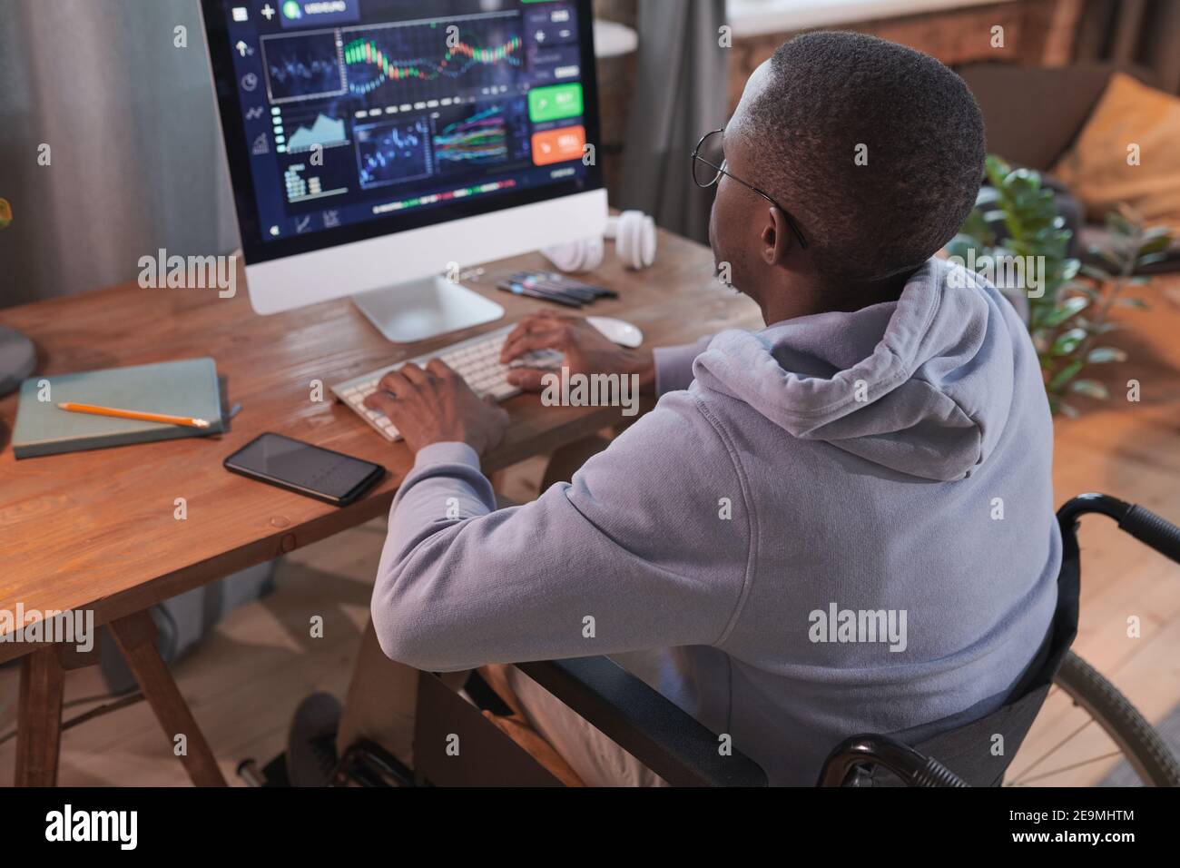 Disabled man using computer typing hi-res stock photography and images ...
