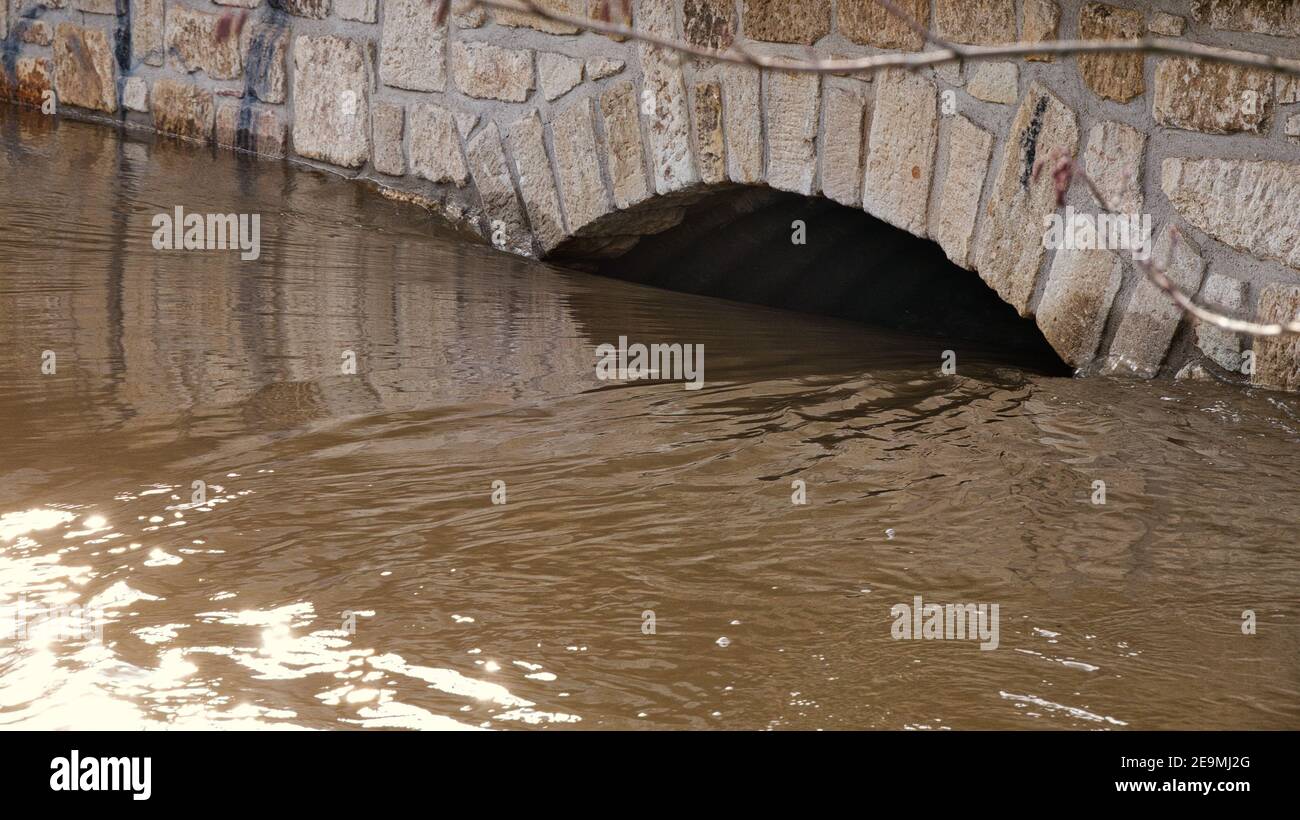 A drain in the sewer system under a bridge allows the amounts of water ...