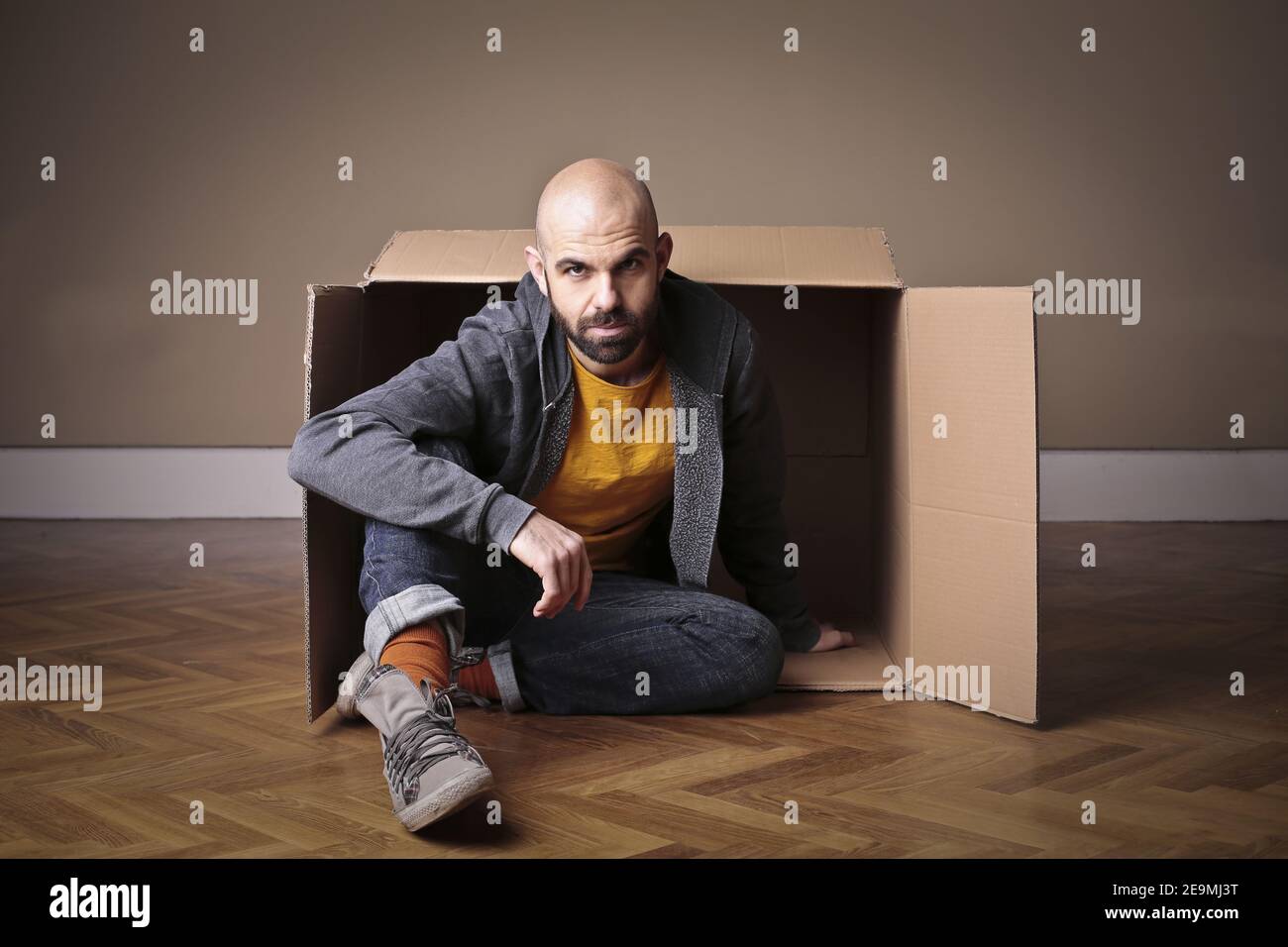 Male model sitting on box hi-res stock photography and images - Alamy