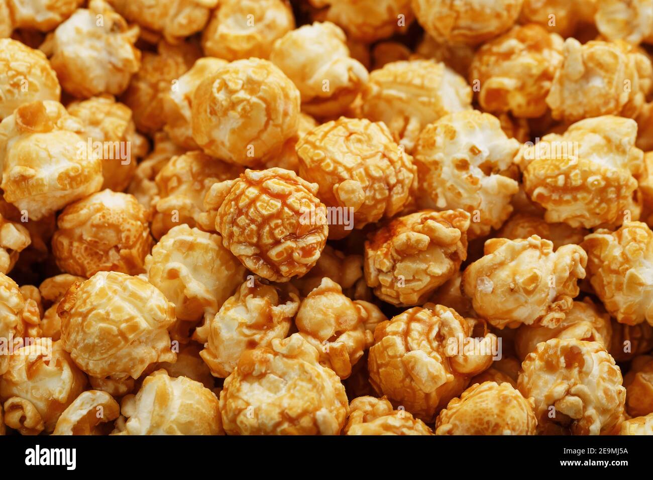 Caramel popcorn close-up as a background, full-screen texture ...