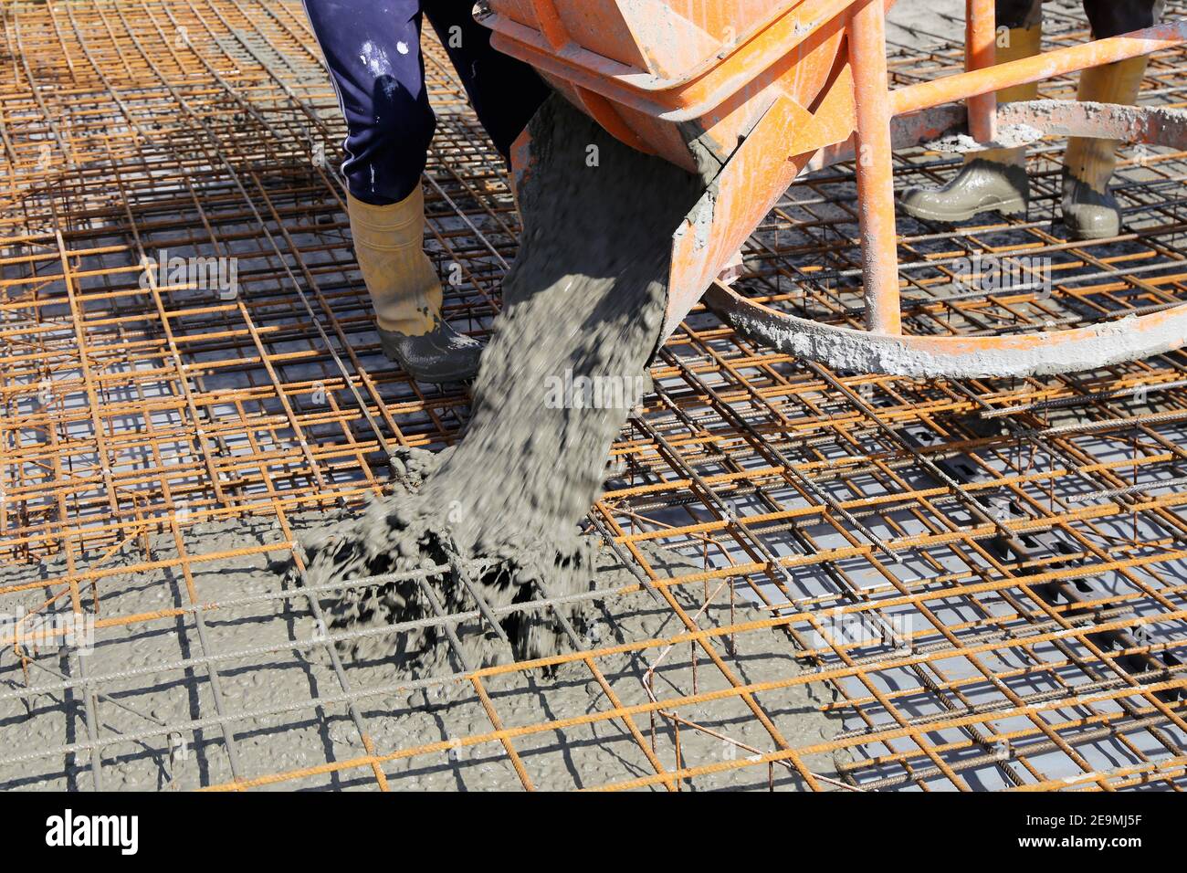 Concreting a base plate with ready-mixed concrete on the construction ...