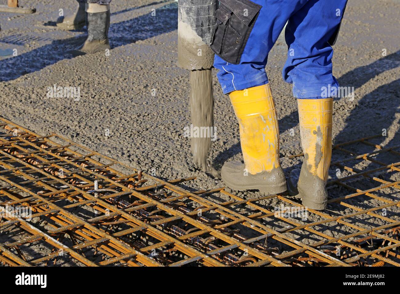 Concreting a base plate with ready-mixed concrete on the construction ...