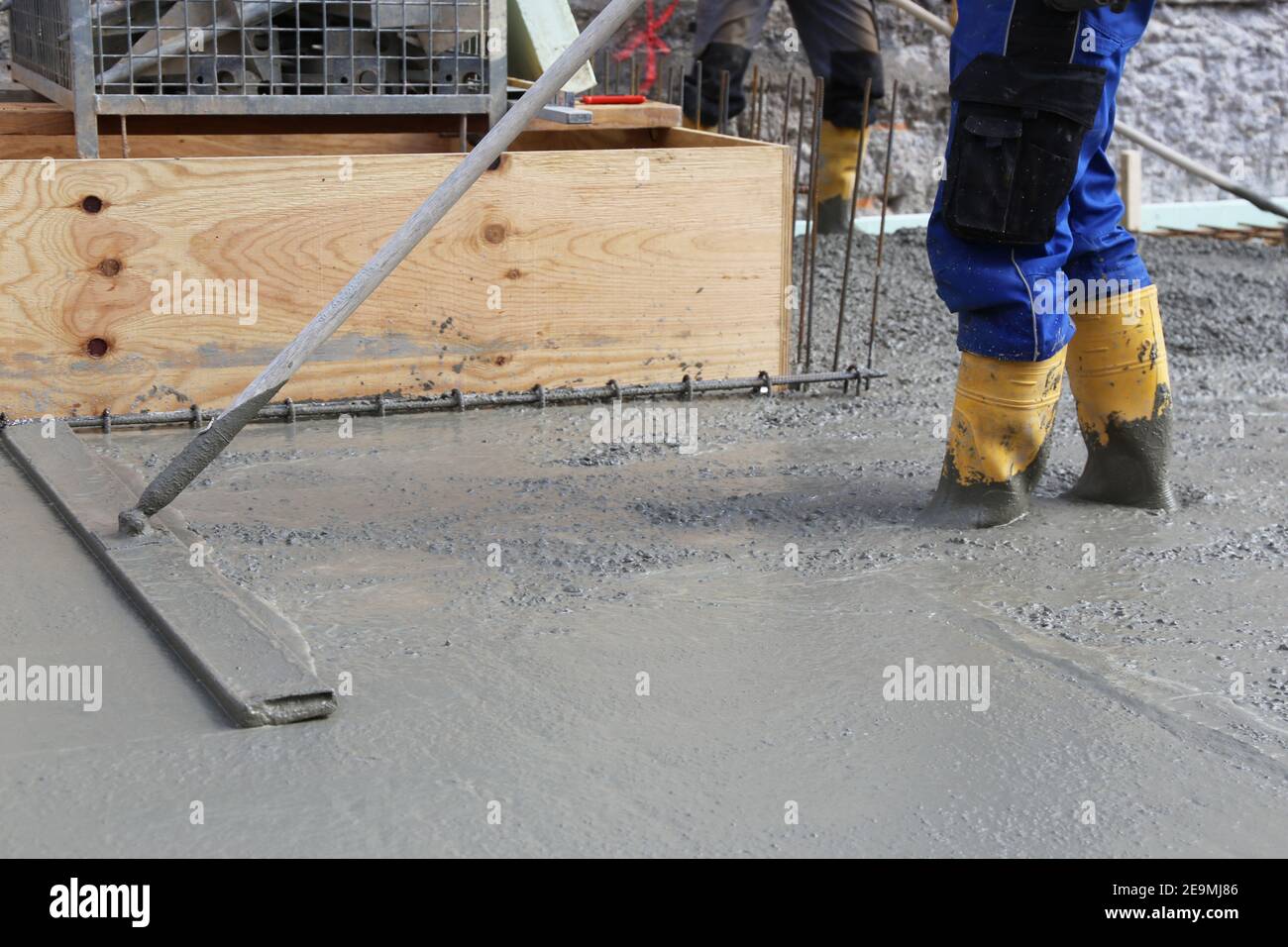Concreting a base plate with ready-mixed concrete on the construction ...