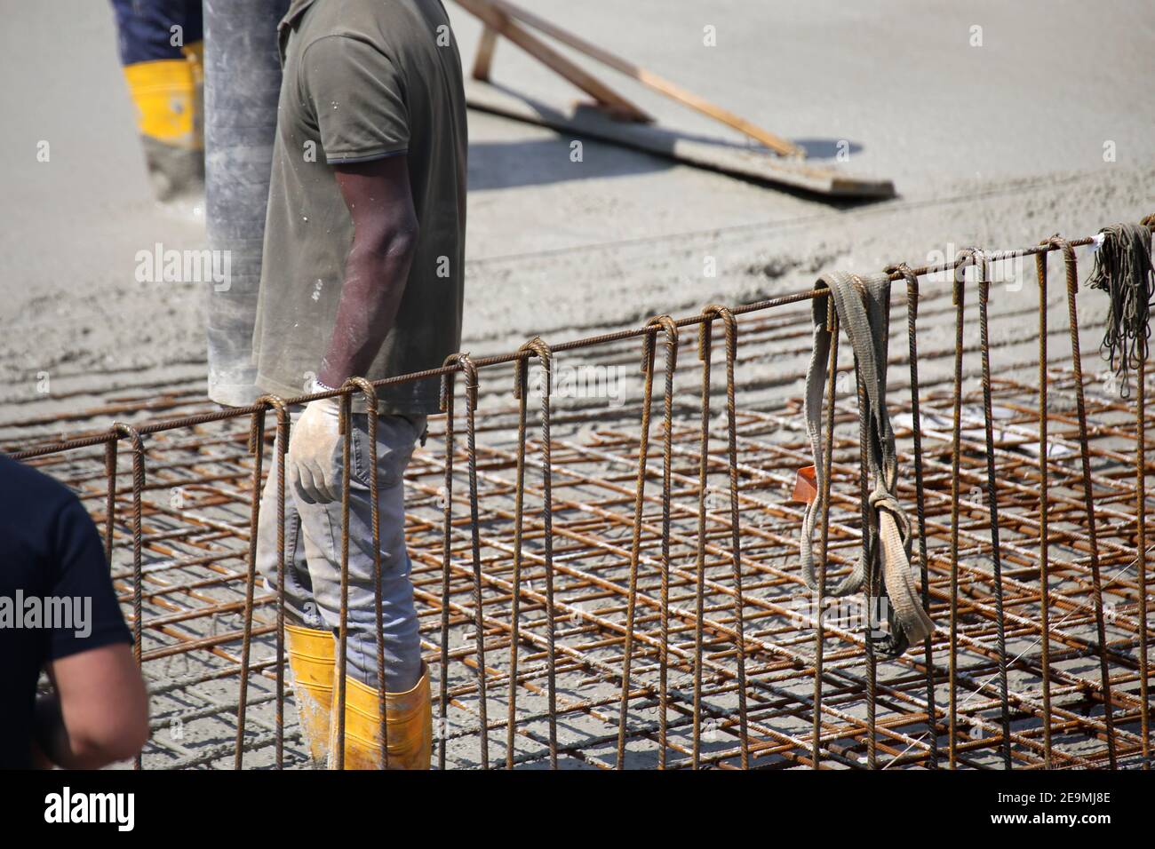 Concreting a base plate with ready-mixed concrete on the construction ...