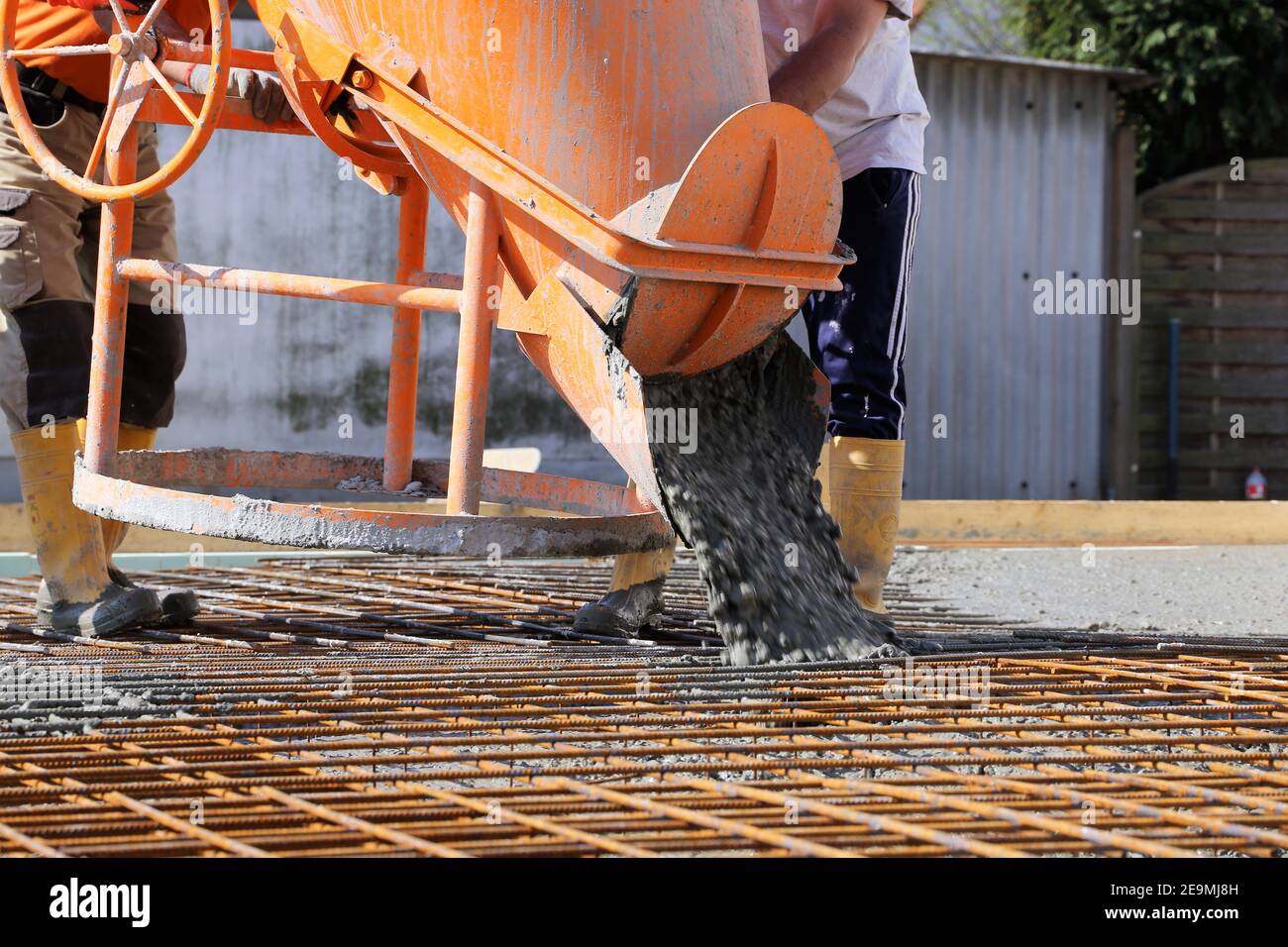Concreting a base plate with ready-mixed concrete on the construction ...