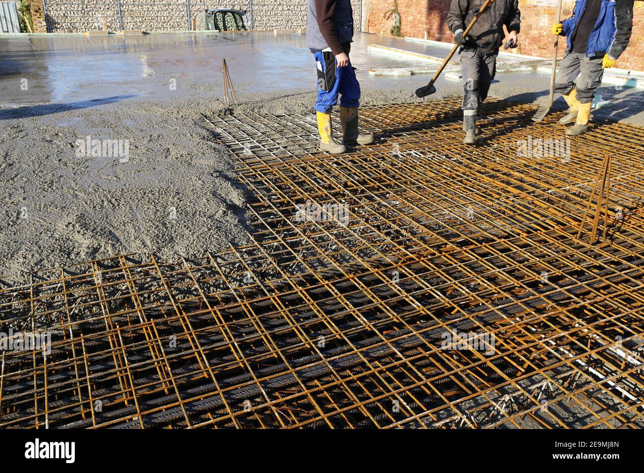 Concreting a base plate with ready-mixed concrete on the construction ...
