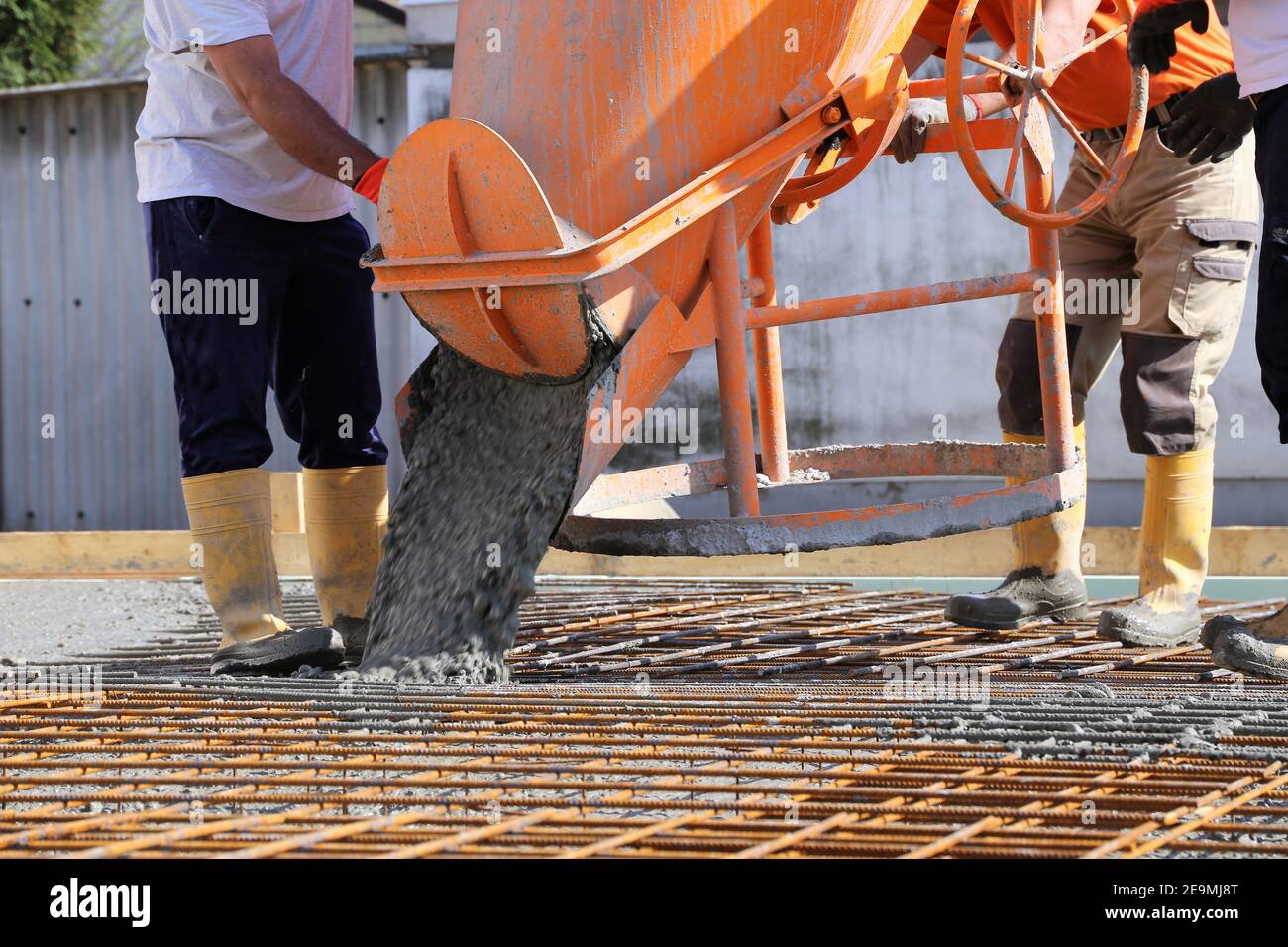 Concreting a base plate with ready-mixed concrete on the construction ...