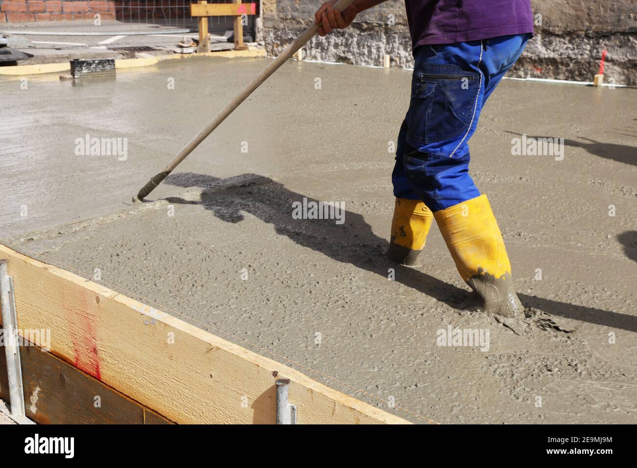 Concreting a base plate with ready-mixed concrete on the construction ...