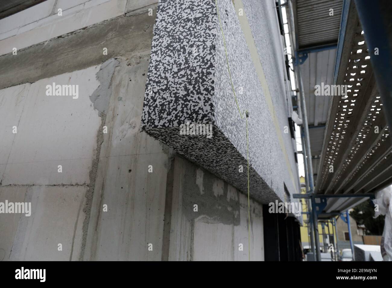 Installation of thermal insulation to a house facade Stock Photo - Alamy