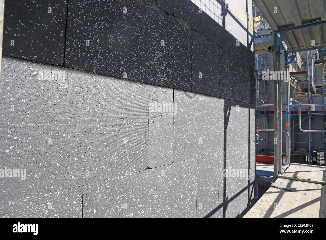 Installation of thermal insulation to a house facade Stock Photo - Alamy