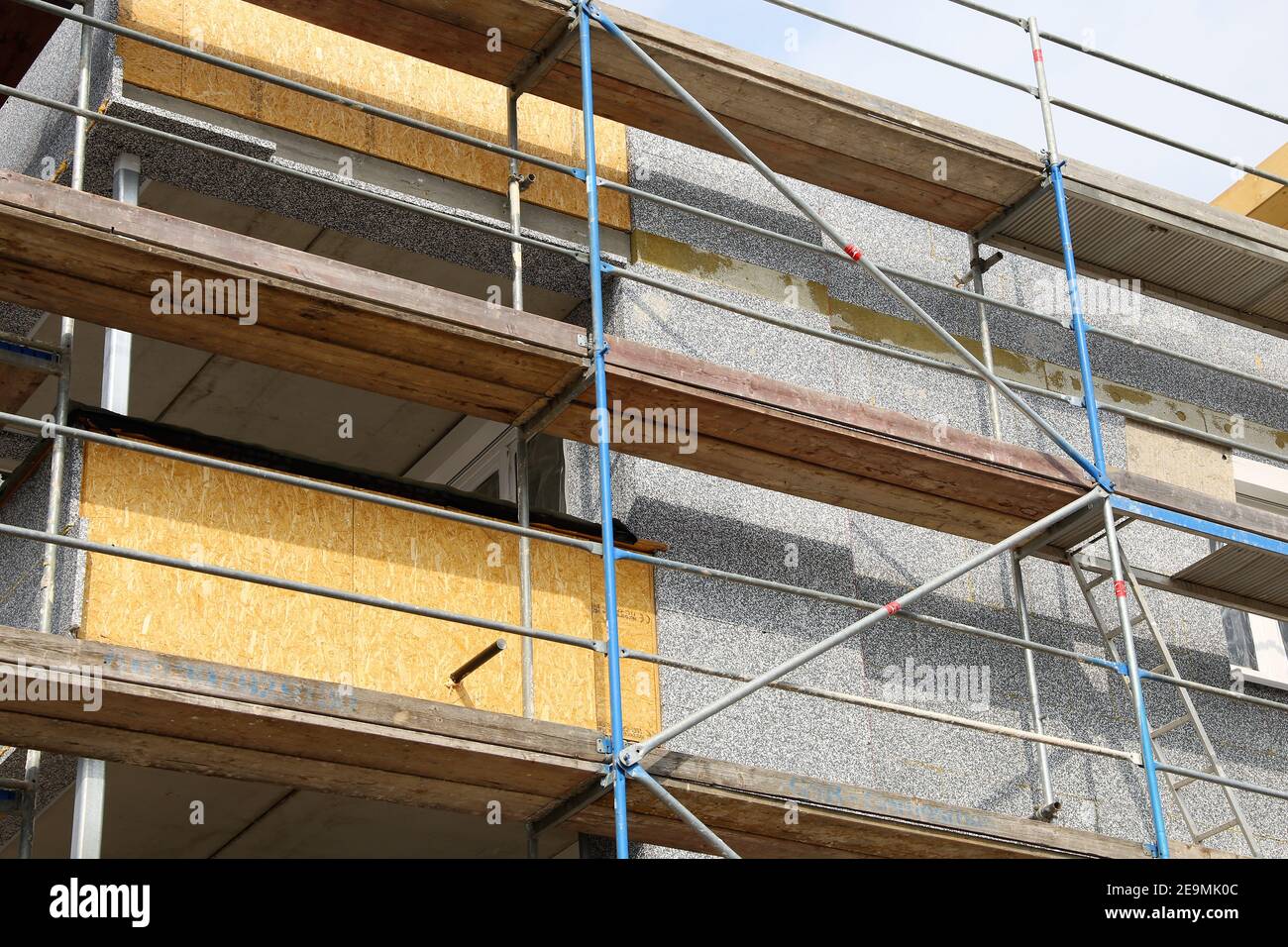 Installation of thermal insulation to a house facade Stock Photo - Alamy