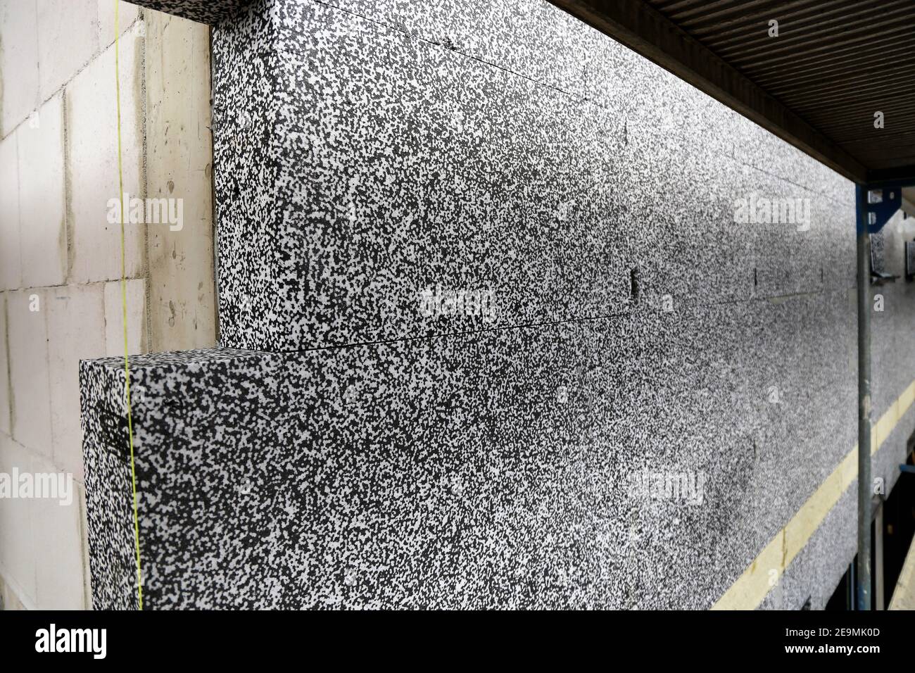 Installation of thermal insulation to a house facade Stock Photo - Alamy