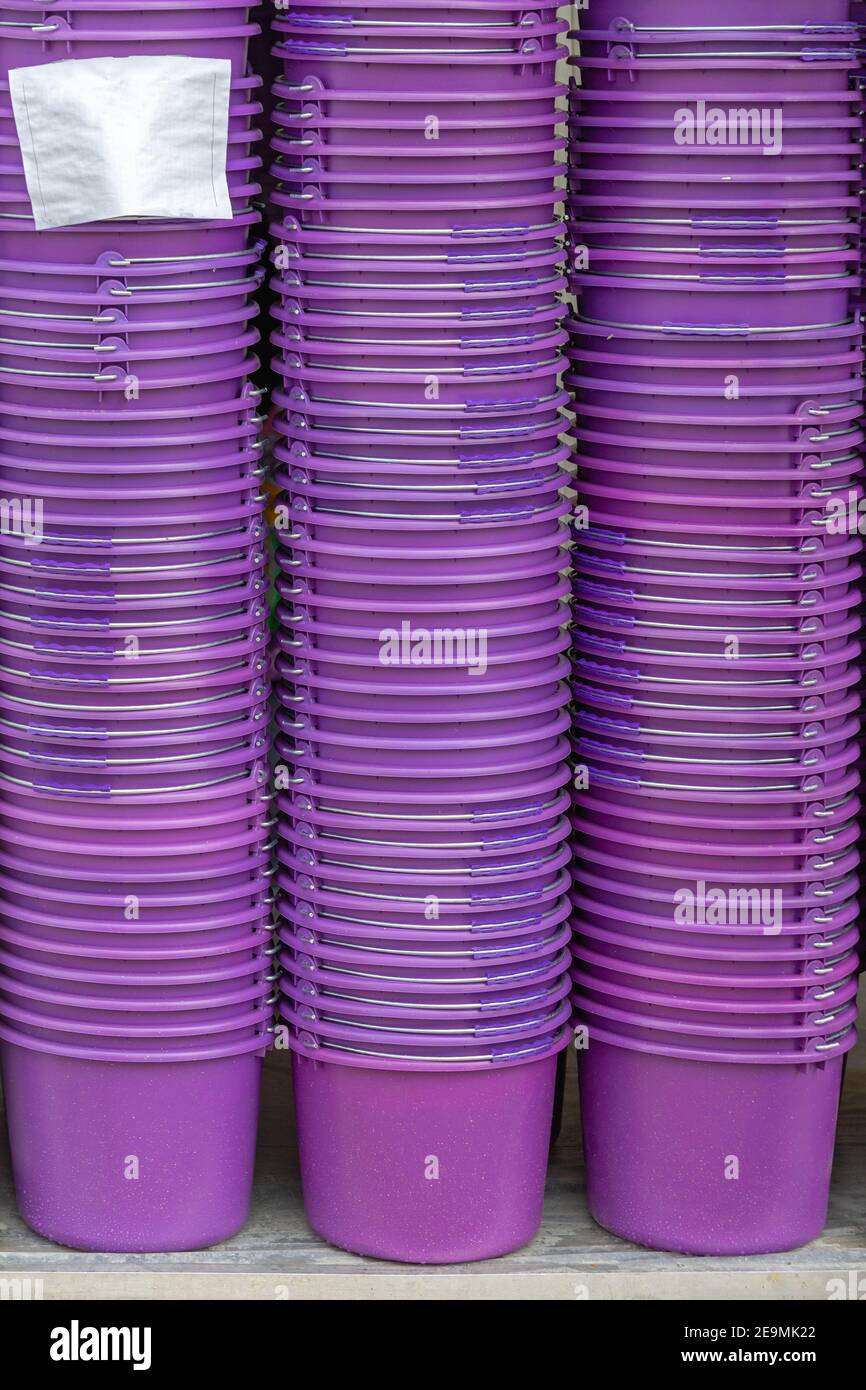 Big Stack of Many Purple Plastic Buckets Stock Photo - Alamy