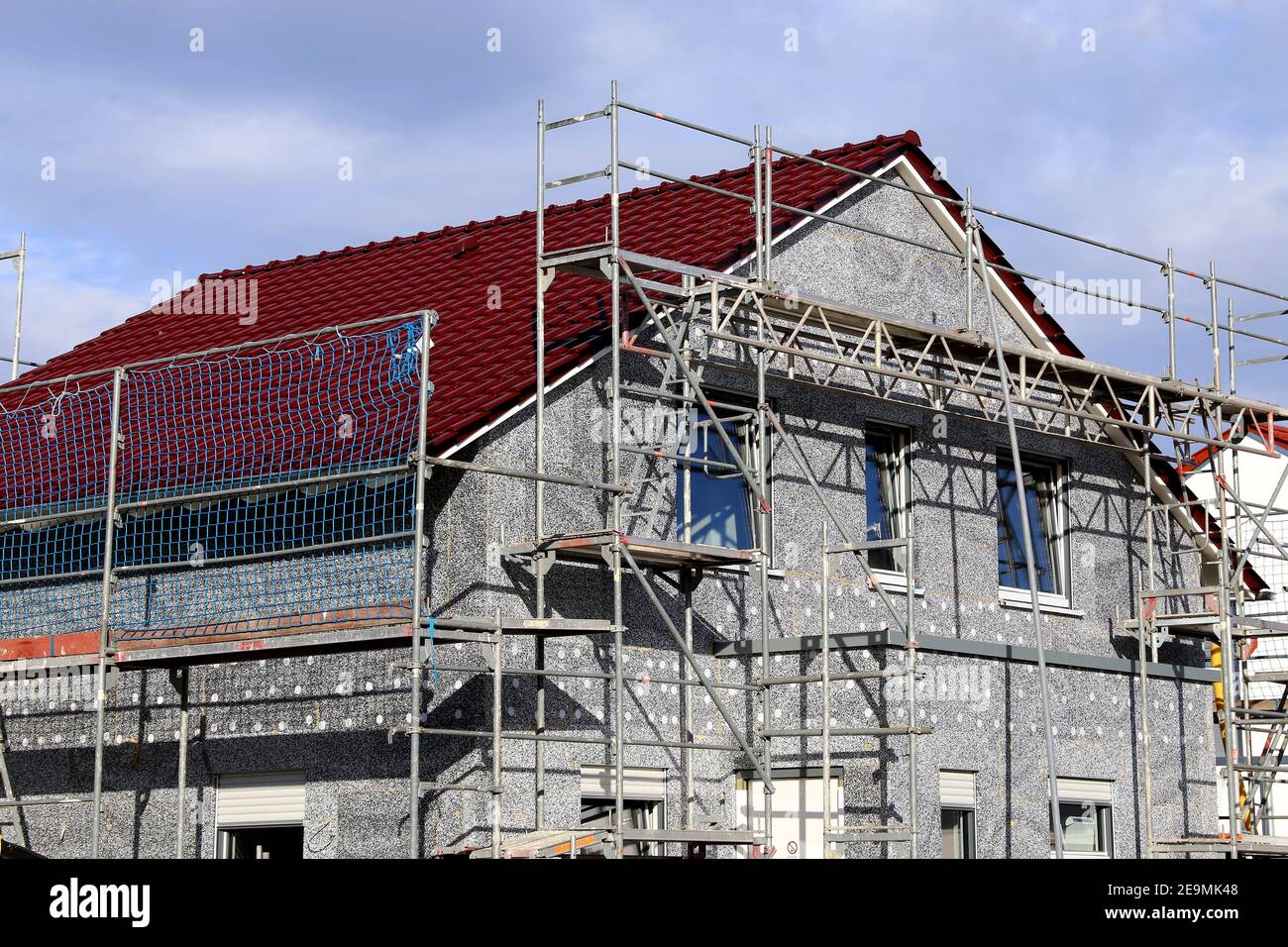 Installation of thermal insulation to a house facade Stock Photo - Alamy
