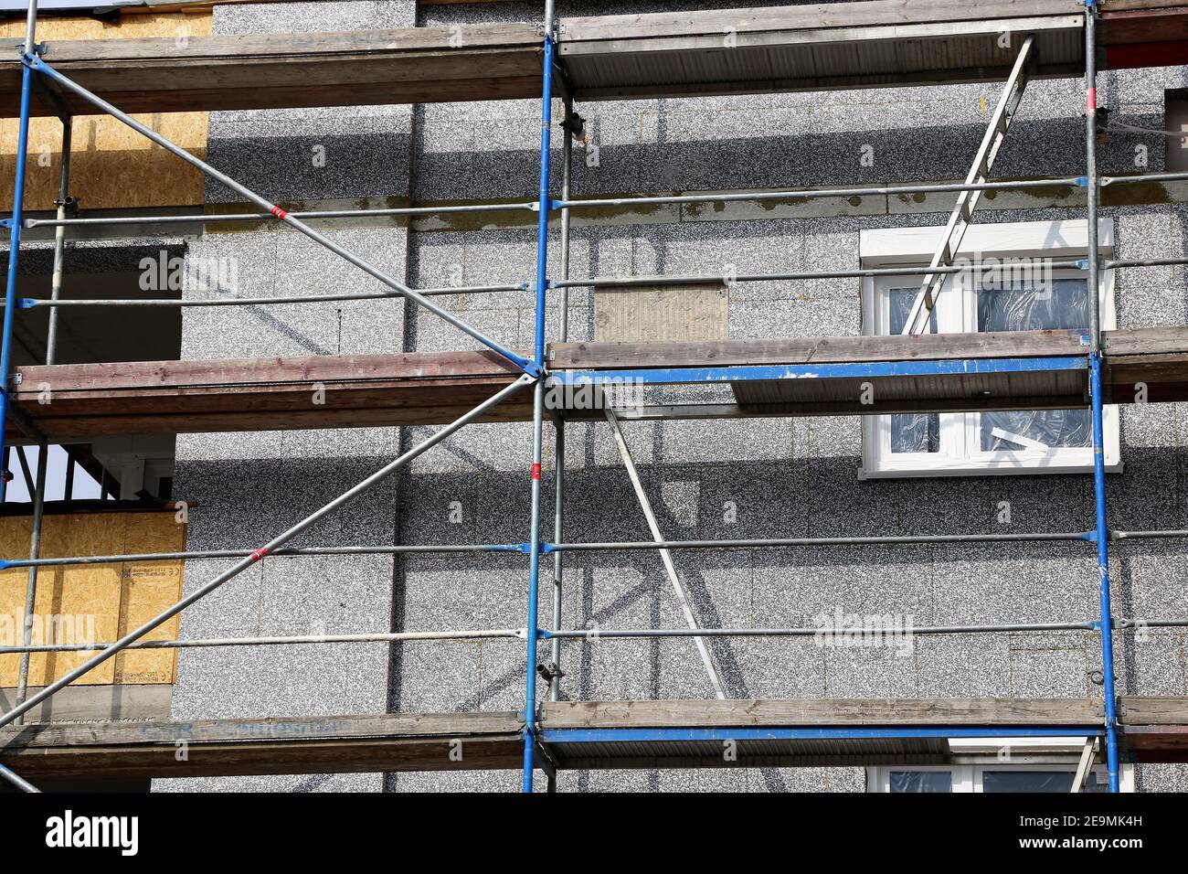 Installation of thermal insulation to a house facade Stock Photo - Alamy