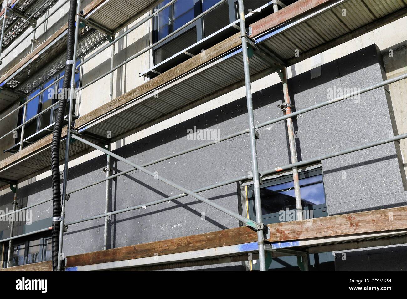 Installation of thermal insulation to a house facade Stock Photo - Alamy