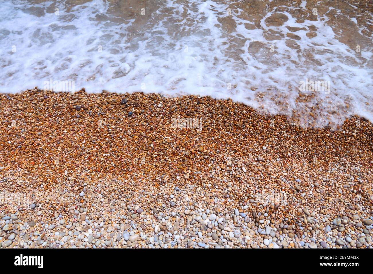 Pebbles background - shingle beach pattern in Gargano Peninsula, Italy ...