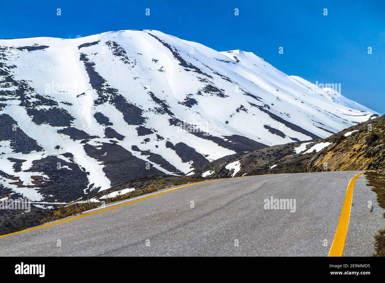 Mountains road wonderland, stunning steep slopes, cliffs and snow ...