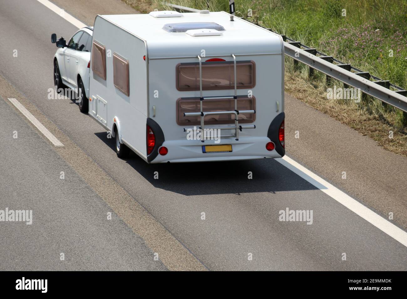 Car towing caravan on european motorway Stock Photo - Alamy