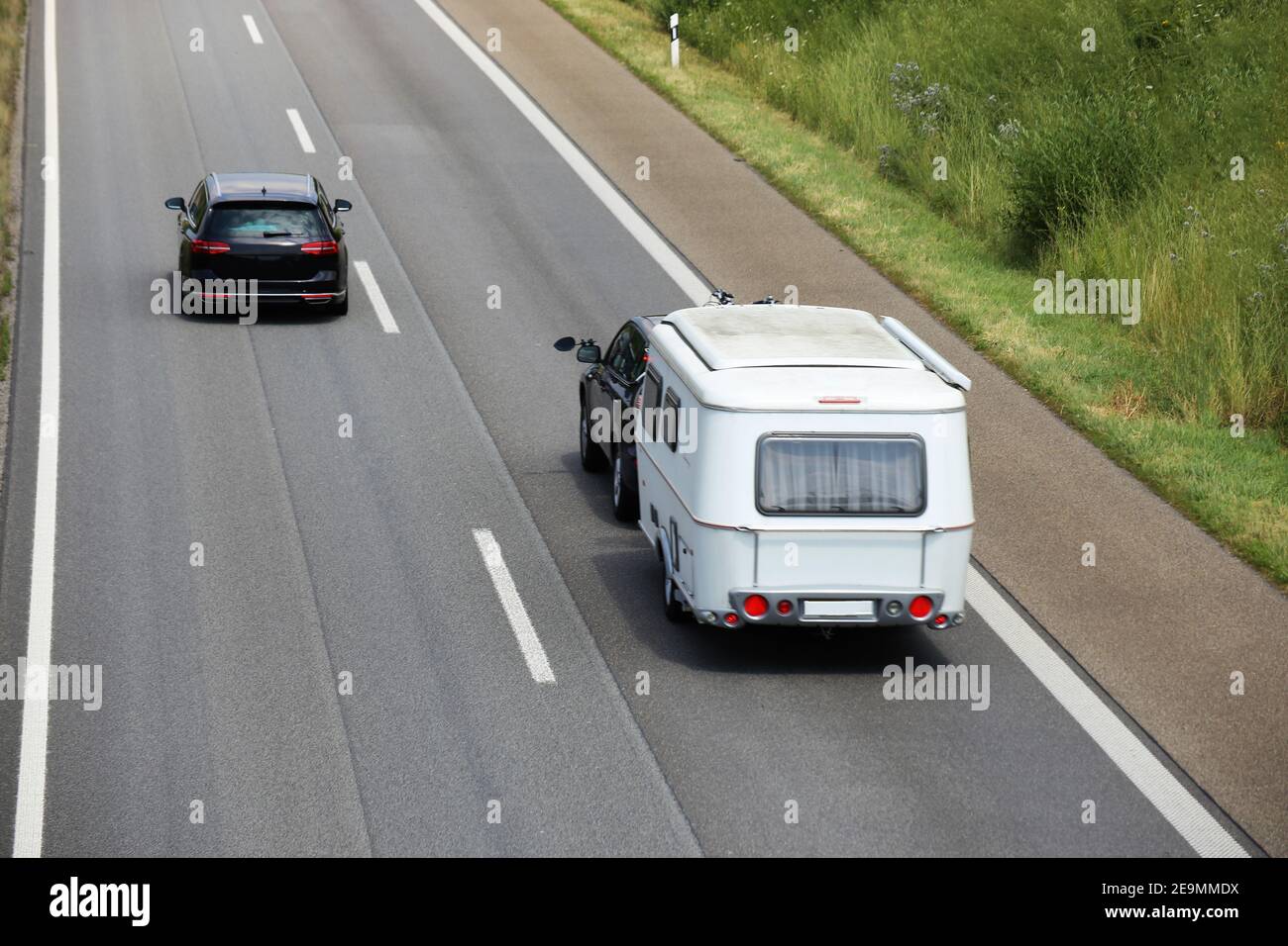 Car towing caravan on european motorway Stock Photo - Alamy