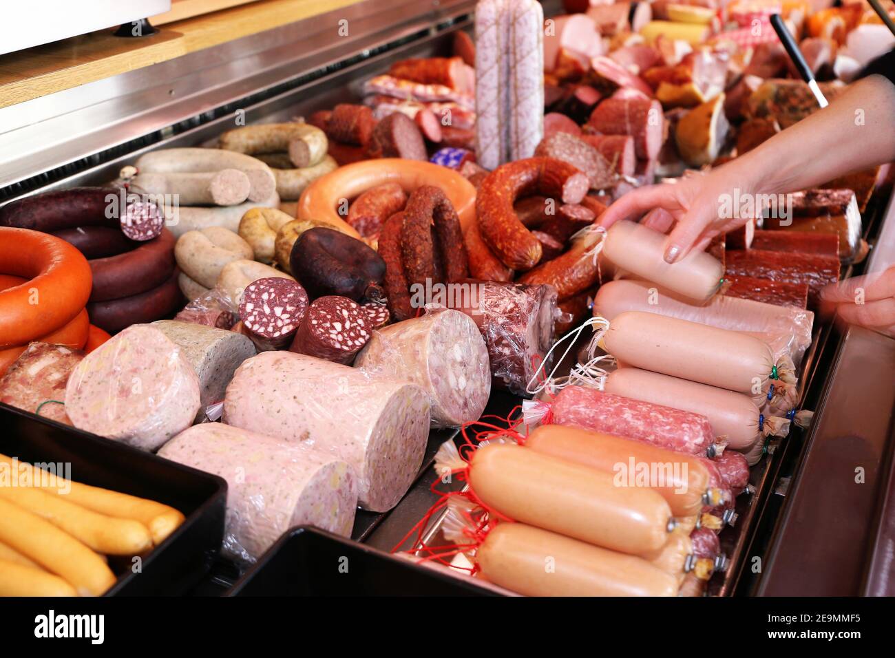 Sausage counter in a butcher's shop Stock Photo - Alamy