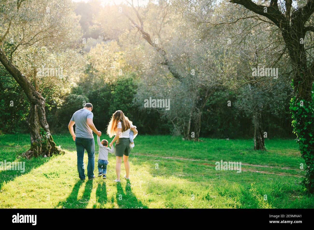 Boy walking under the tree hi-res stock photography and images - Alamy