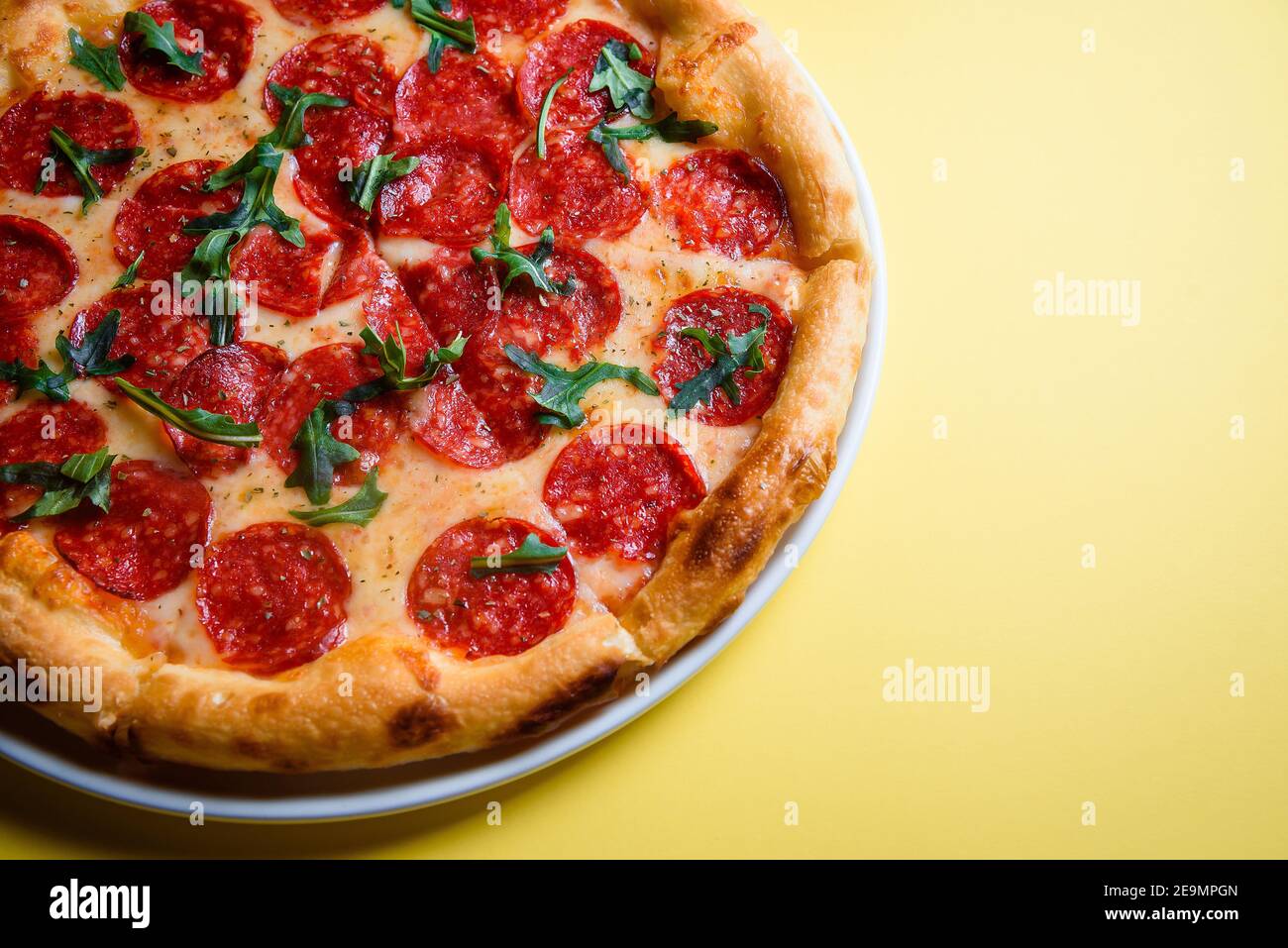 pizza on yellow background, pizza corner, salami, pepperoni, cheese, on ...