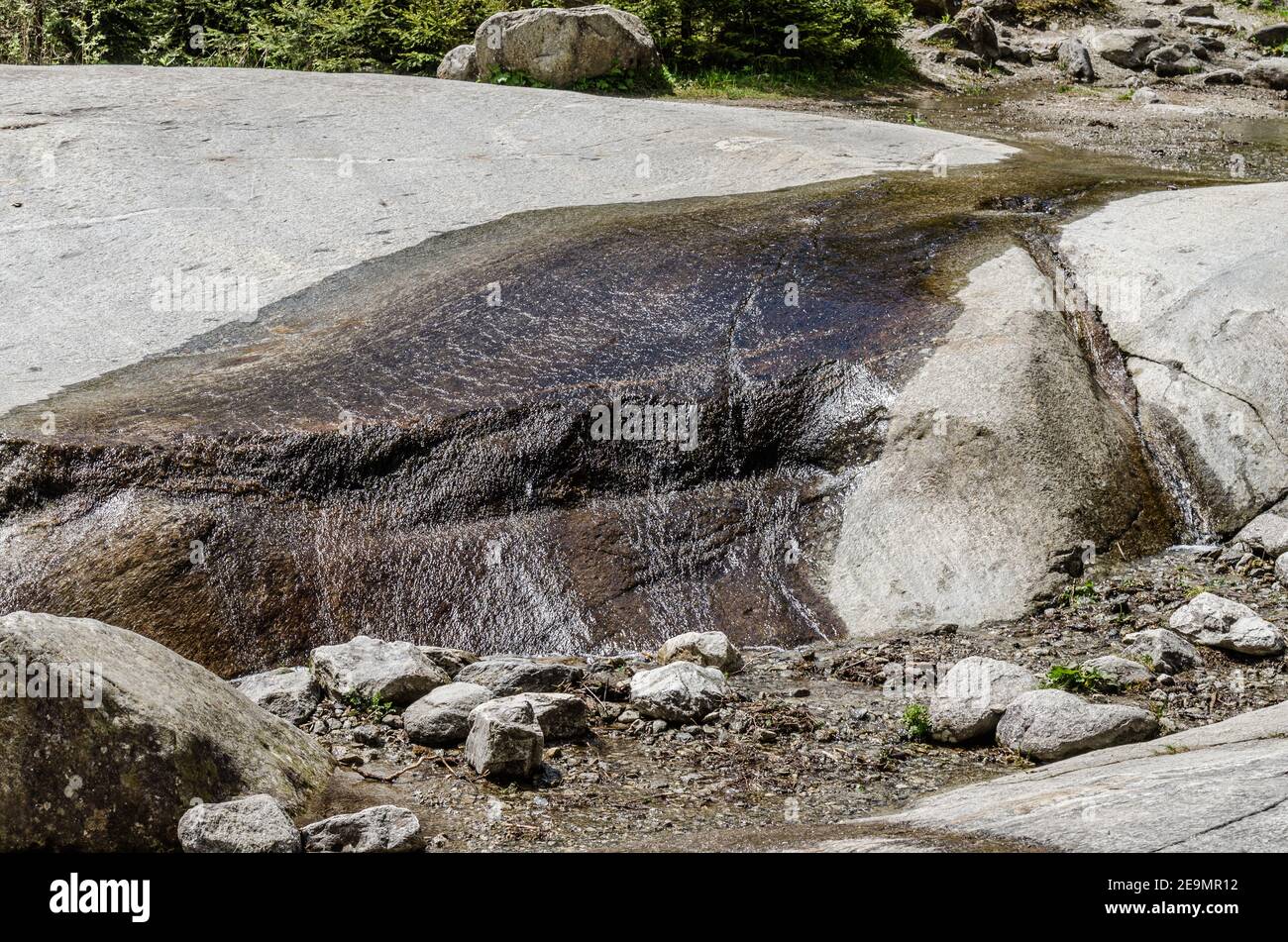 shallow water over rocks in summer Stock Photo - Alamy