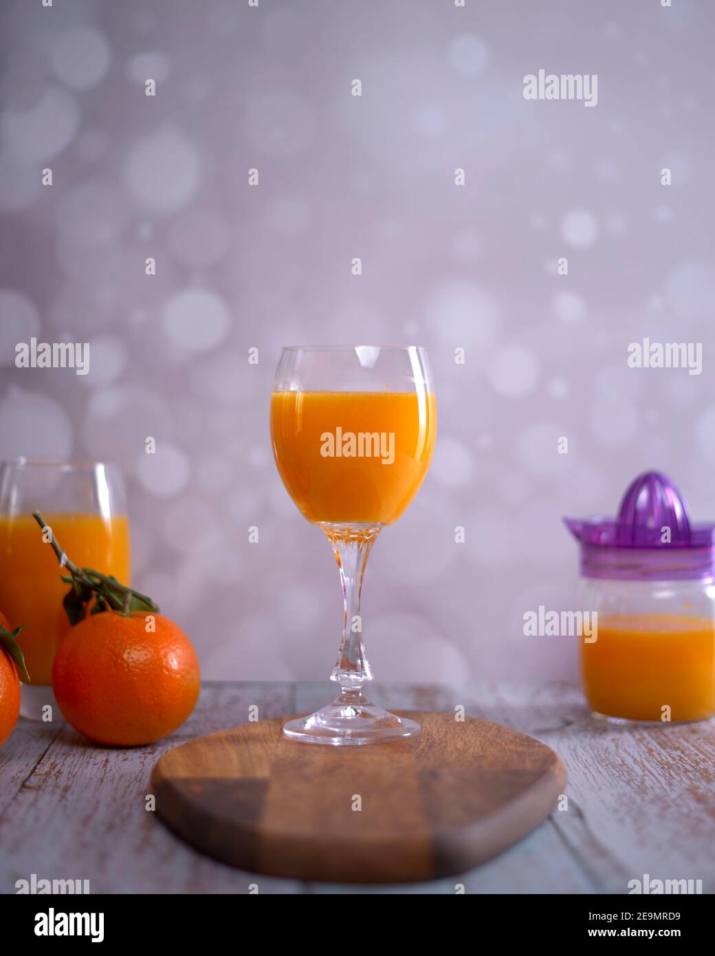 Glass of orange juice. glass juicer, orange juice, wooden table whole ...