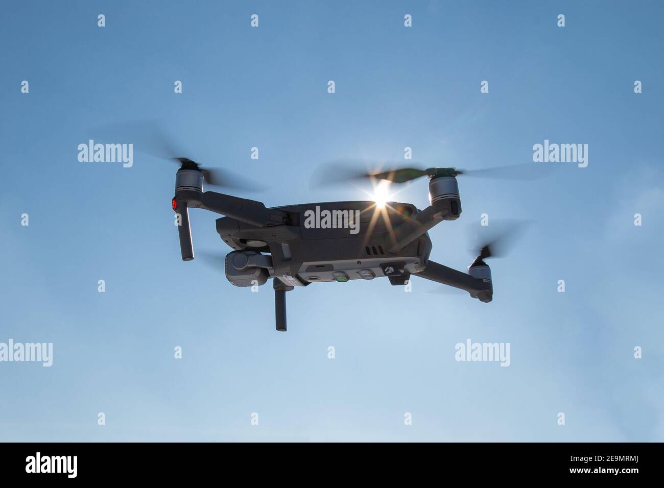 Drone flying in the blue sky , Drone Flying in Sunlight Stock Photo - Alamy