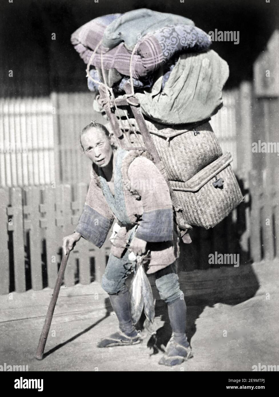 Late 19th century photograph - Porter with a heavy load, Japan, c.1870 ...