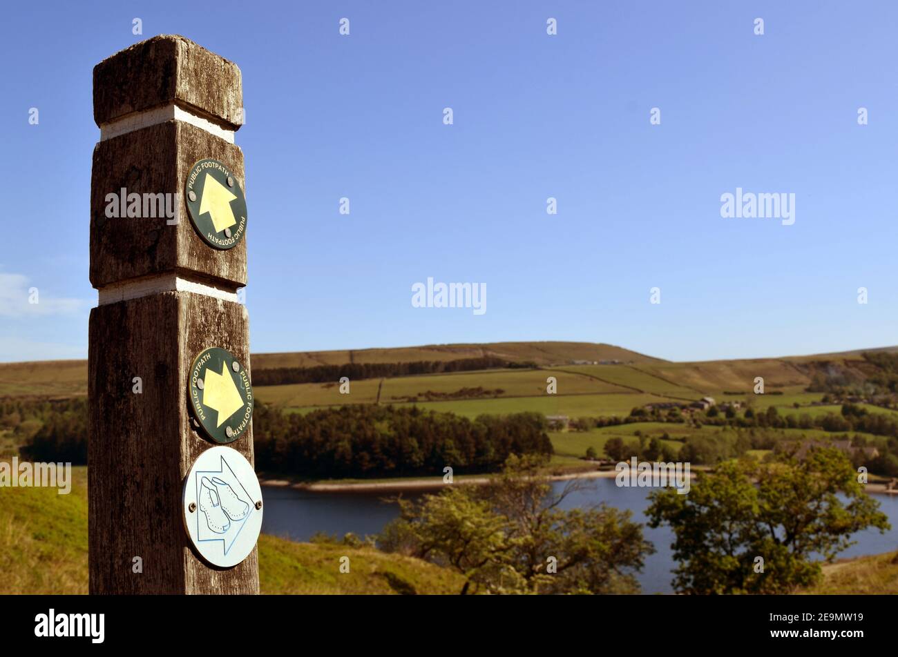 walk marker post up in the moors above a lake in Lancashire Stock Photo ...