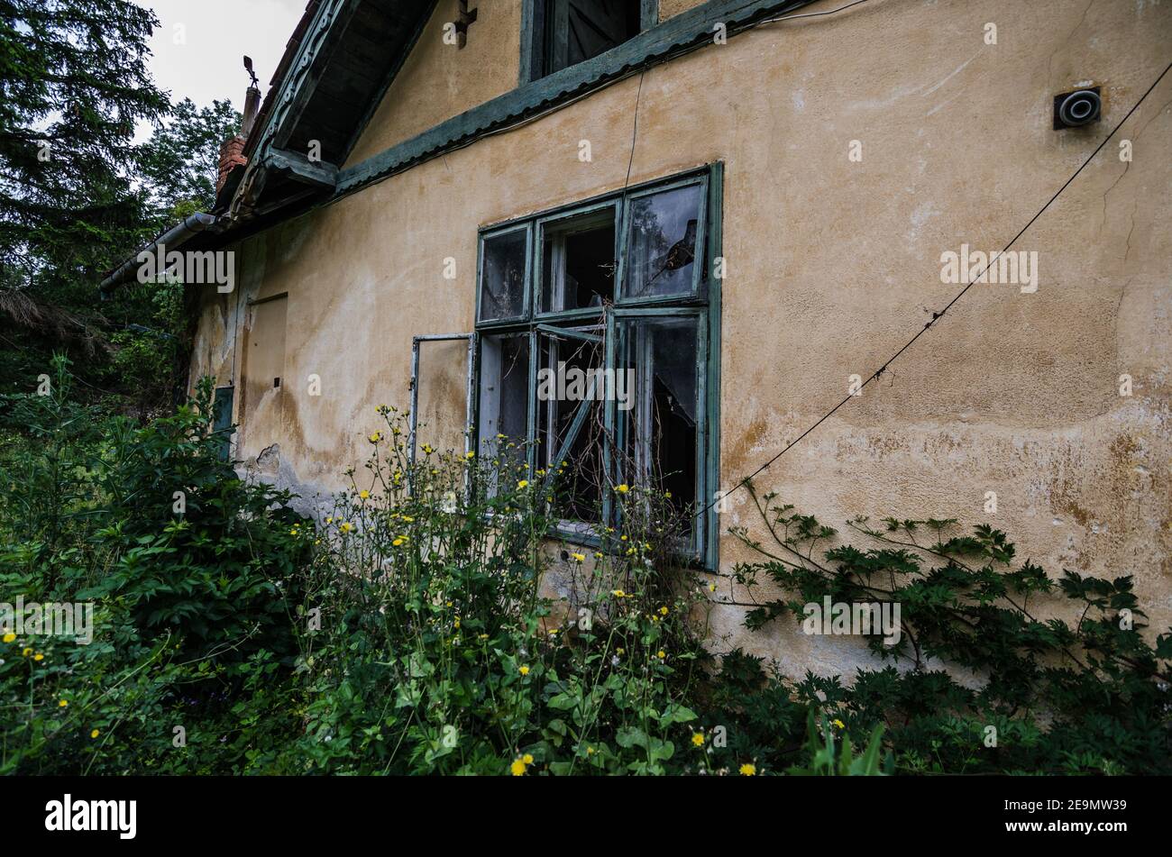 old overgrown house with garden Stock Photo - Alamy