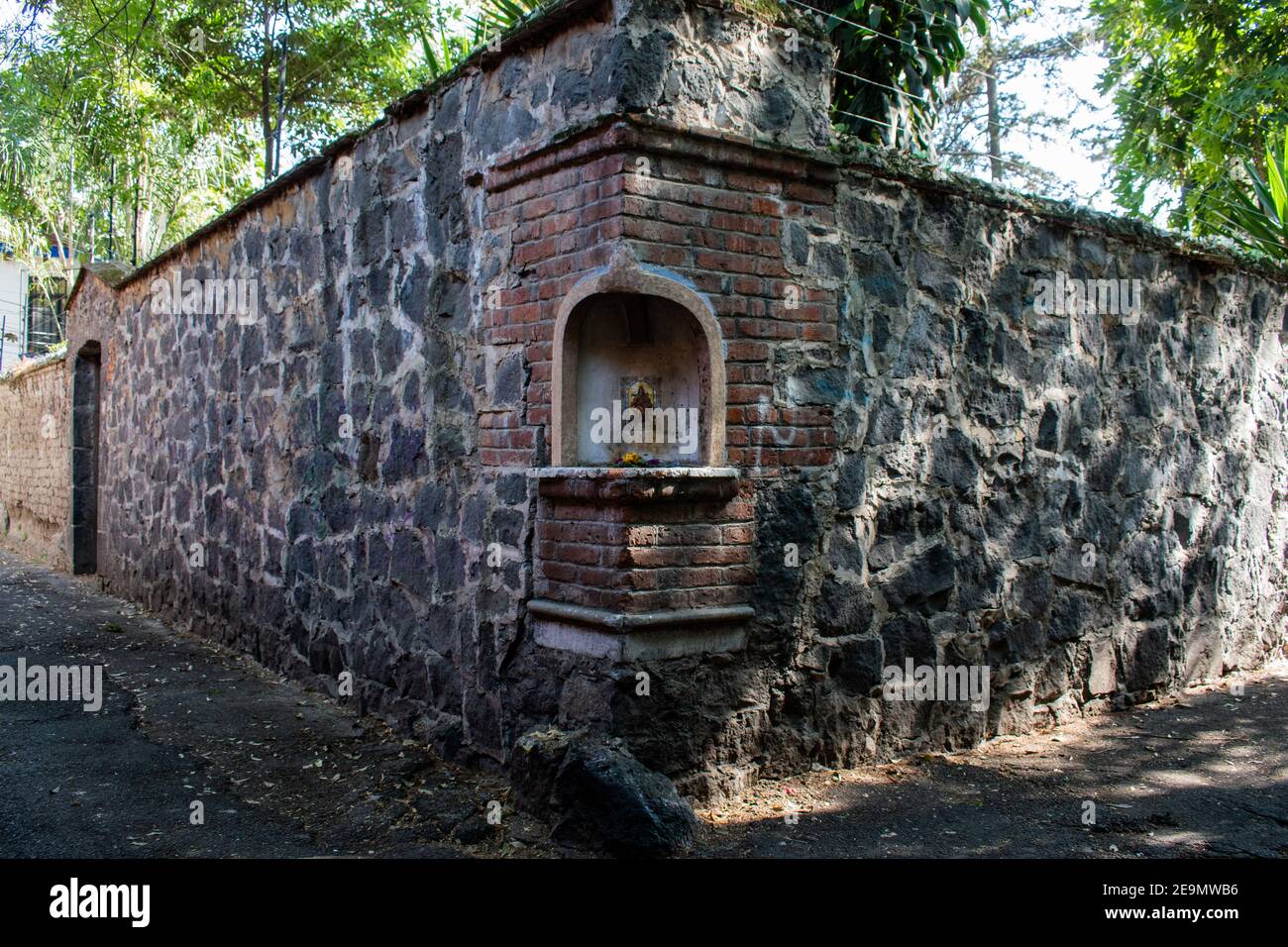 Small altar on the corner of a stone wall Stock Photo - Alamy
