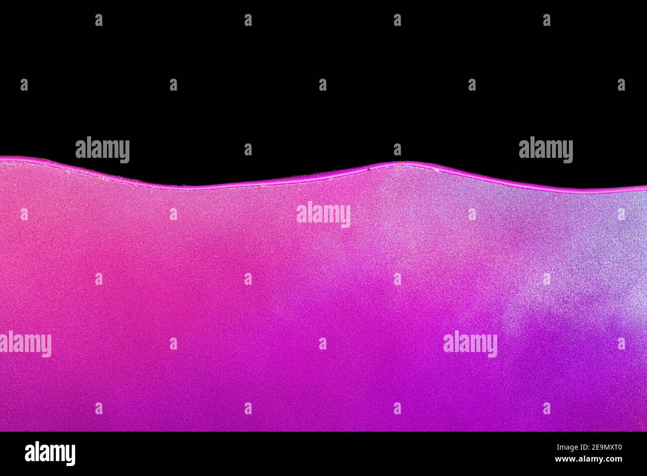 Pink bubbly boiling water against black background Stock Photo - Alamy