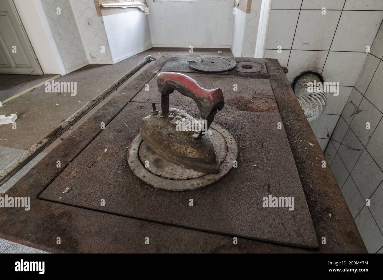 old iron on a stove Stock Photo - Alamy