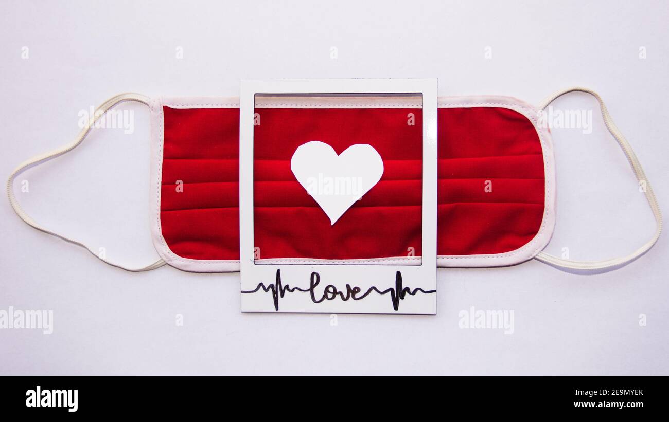 medical red mask with white heart in the middle of picture frame with ...
